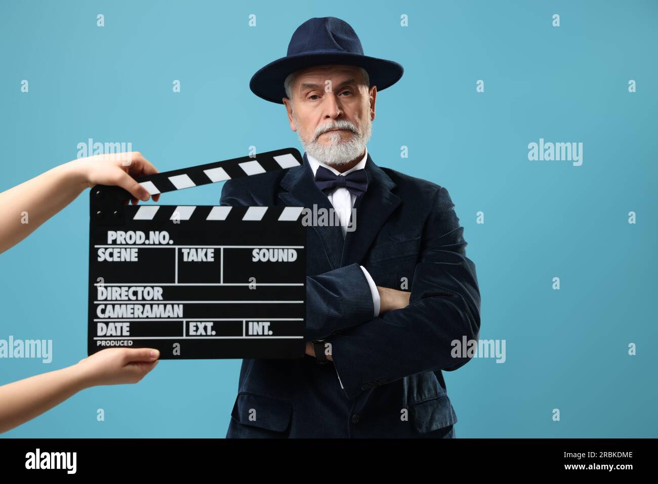 Senior actor performing role while second assistant camera holding ...