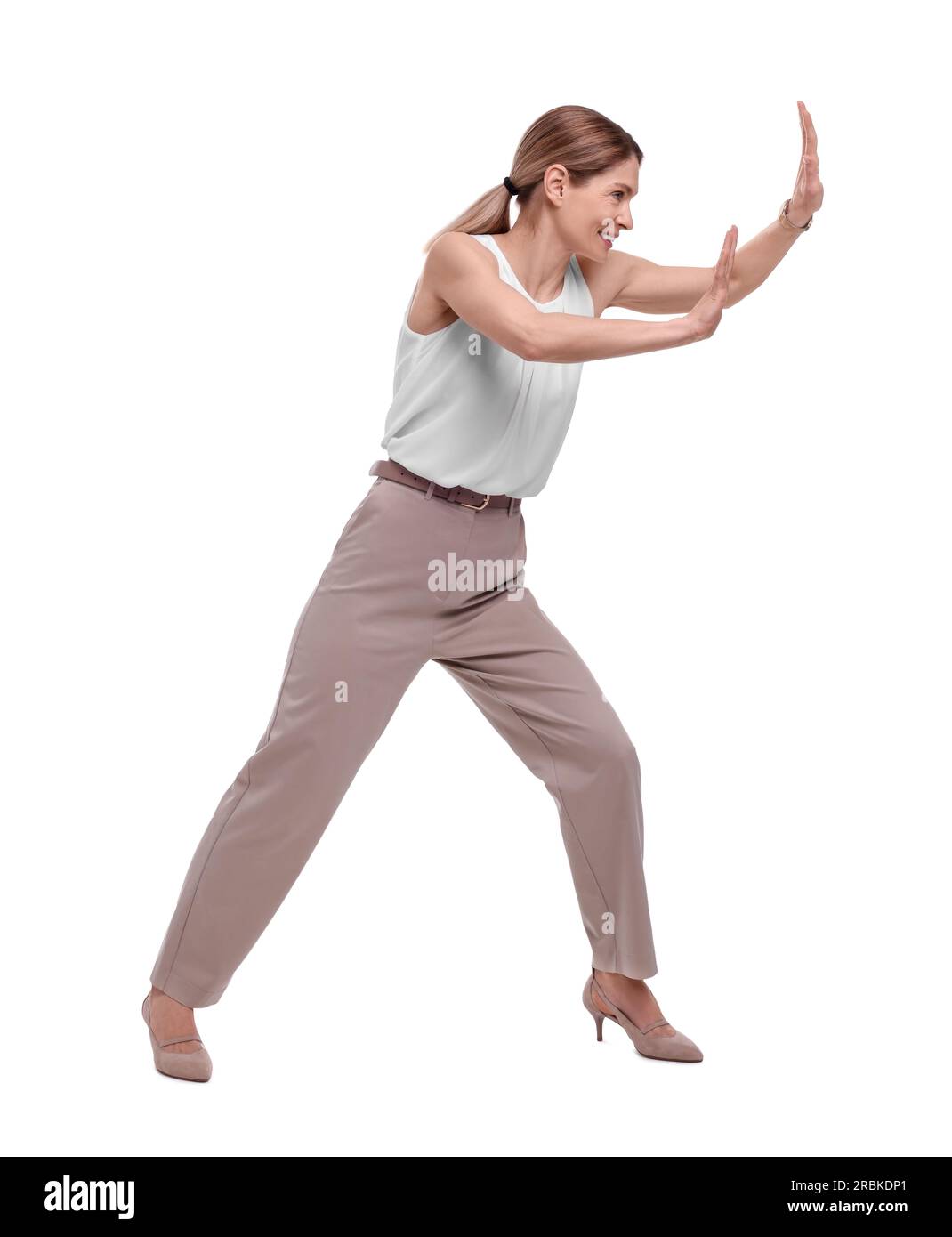 Beautiful businesswoman avoiding something on white background Stock ...