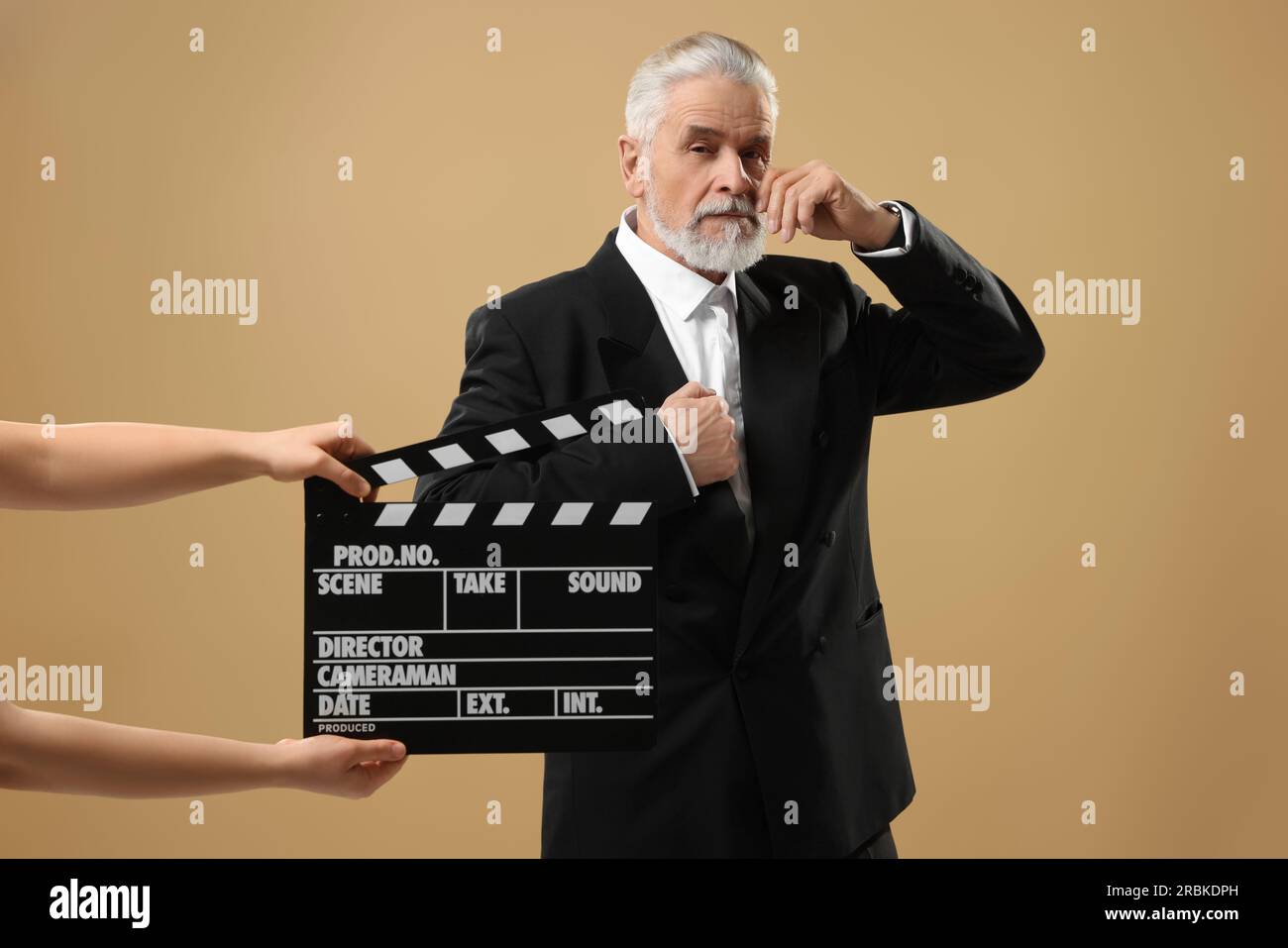 Senior actor performing role while second assistant camera holding ...