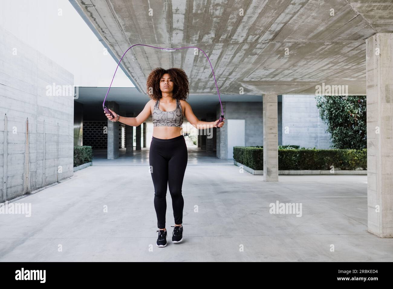 Curvy African American Woman Skipping Rope In Urban Area Stock Photo ...