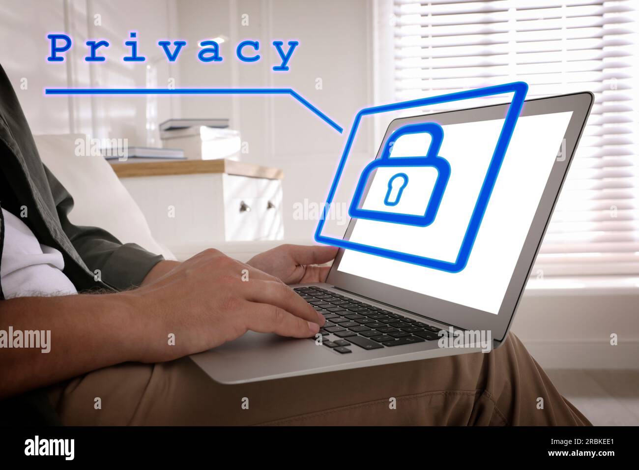 Virtual screen with padlock and word Privacy. Man with laptop indoors ...