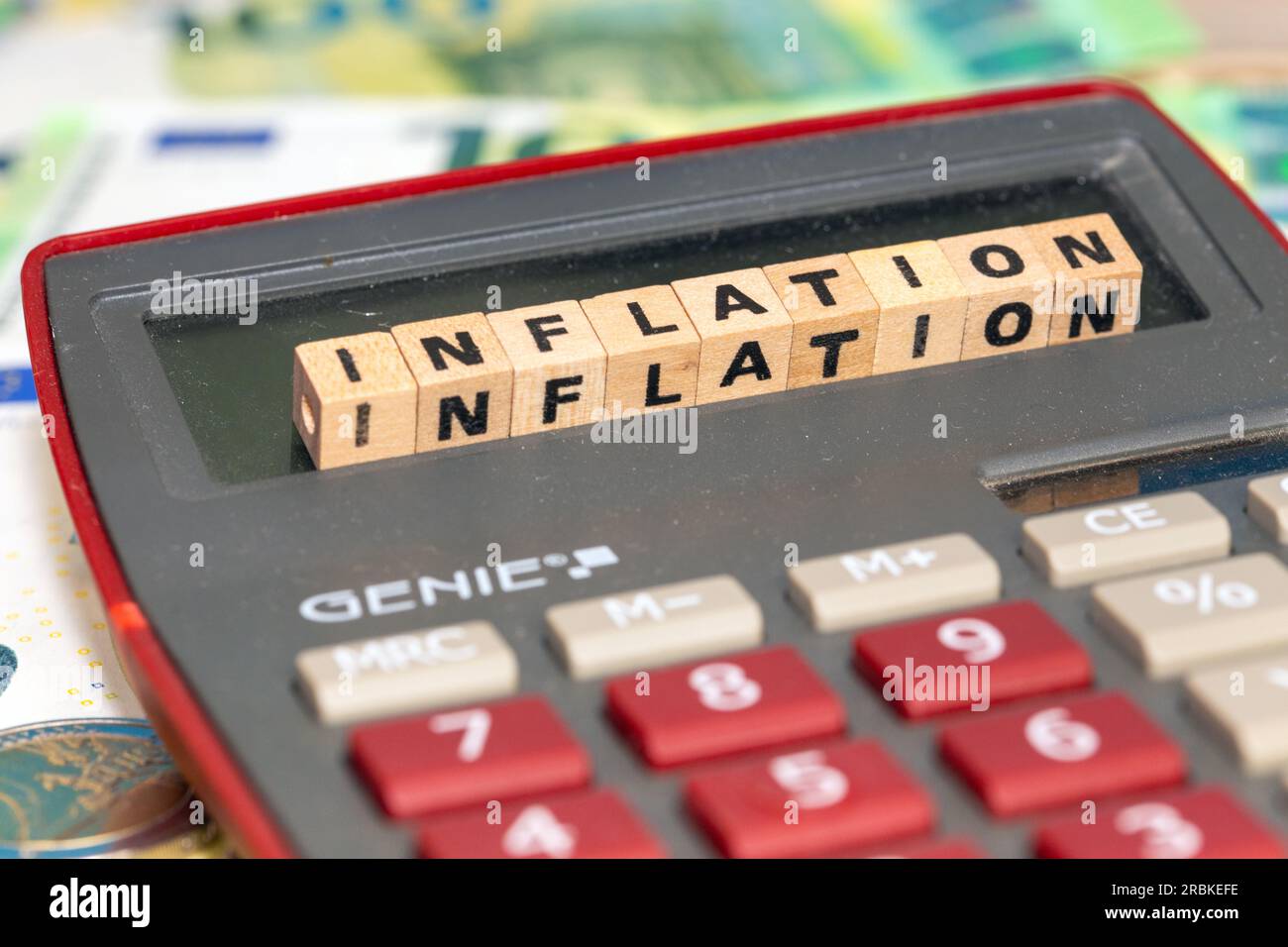 Symbol image of inflation: Letter cubes on a calculator display the ...