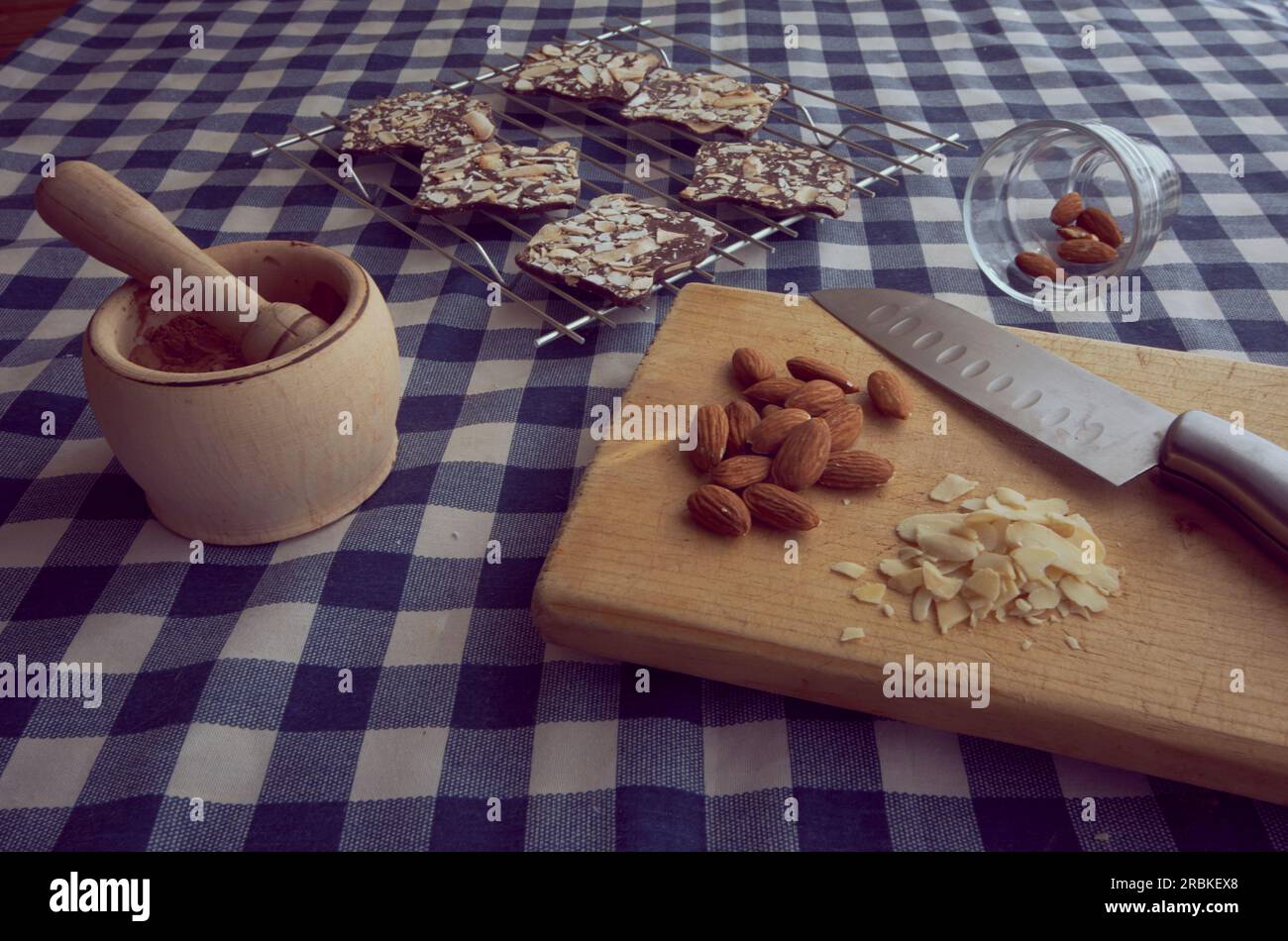 Making chocolate snaks with sliced ??almonds Stock Photo - Alamy