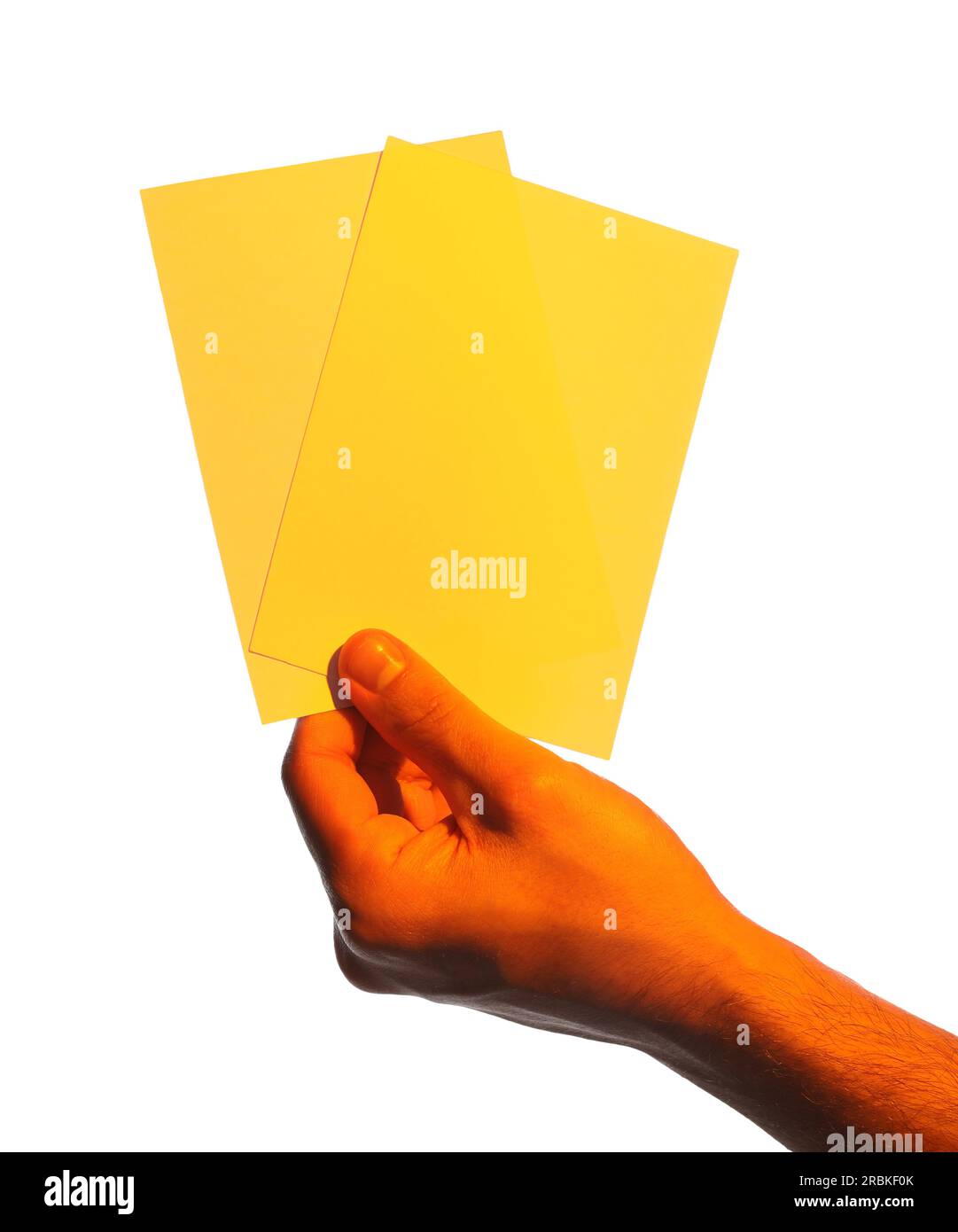 Man holding yellow flyers on white background, closeup. Mockup for ...