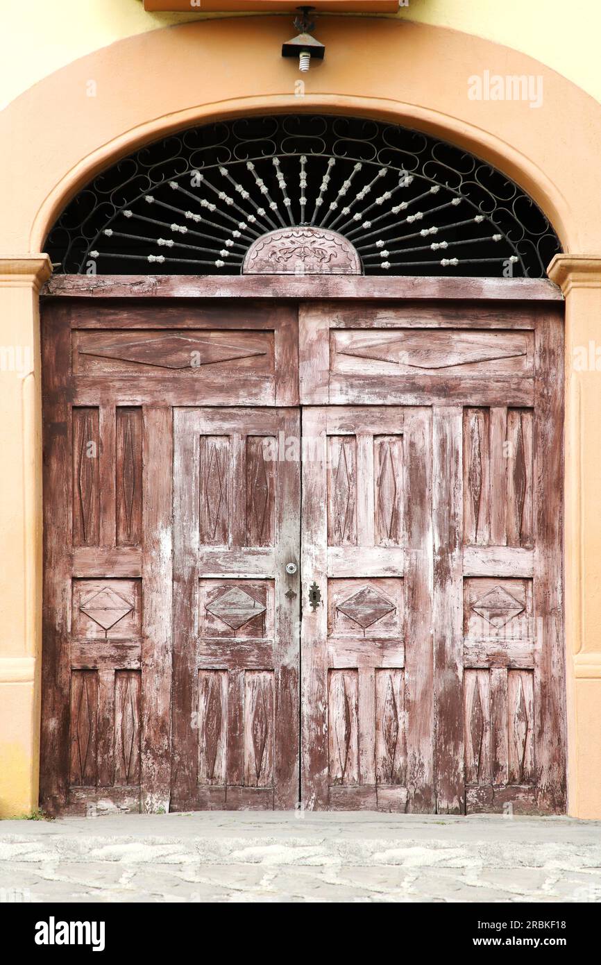 Exterior of building with old wooden gates Stock Photo - Alamy