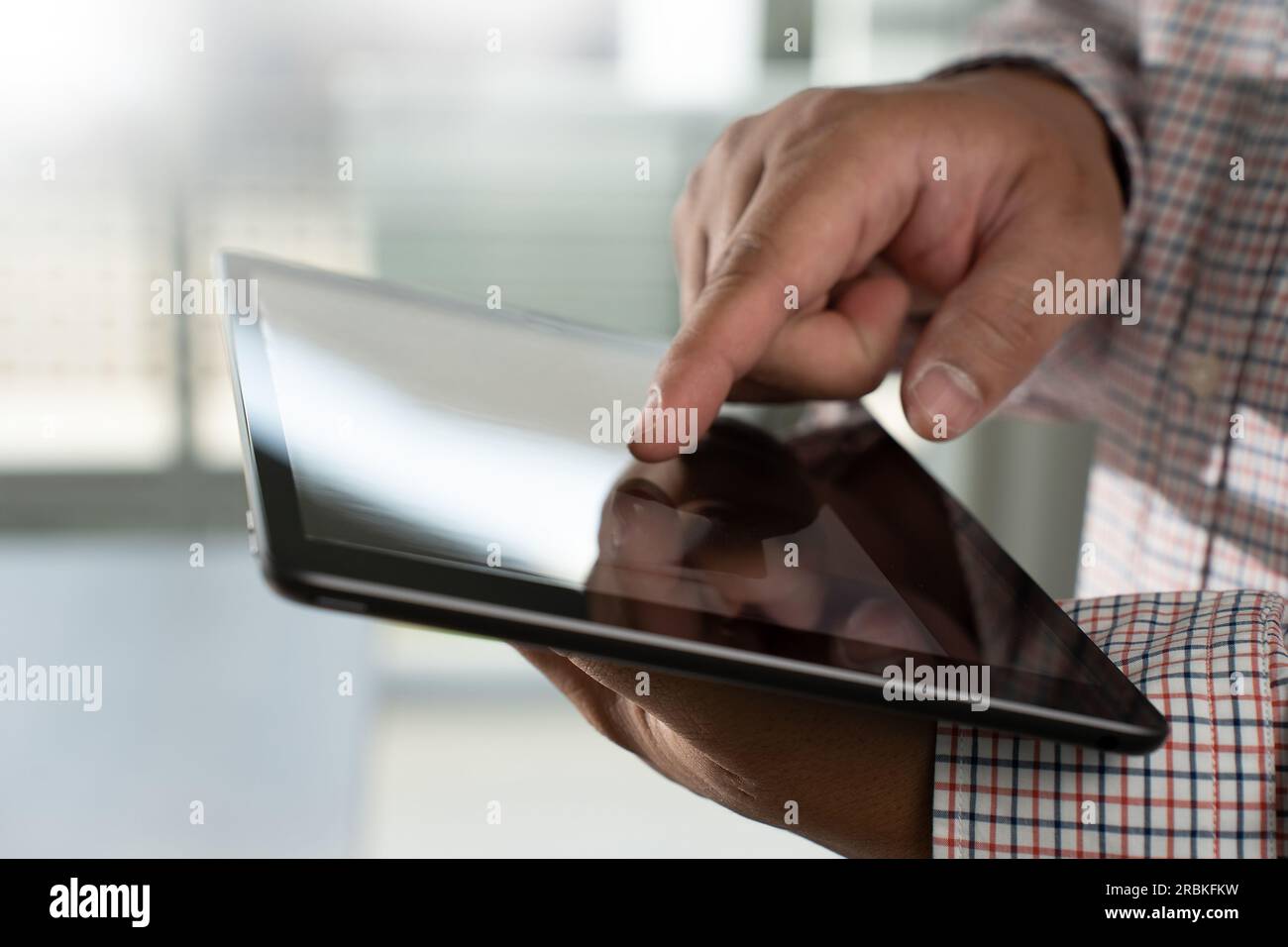 Man hands using looking and touch tablet laptop and cellphone ...