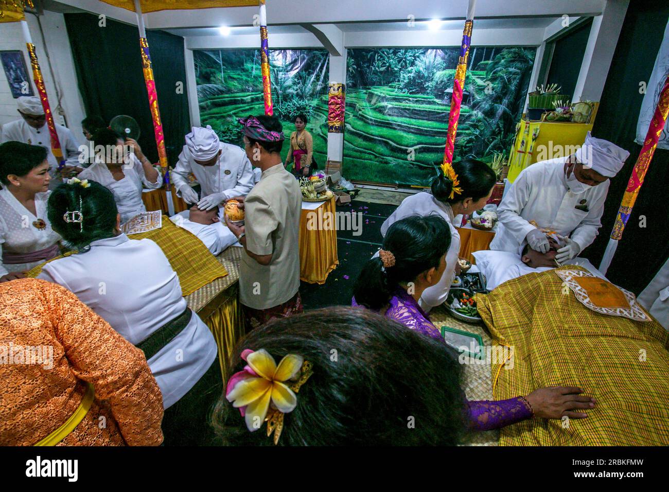 Dentists file the teeth in the tooth-cutting procession at the Giri ...