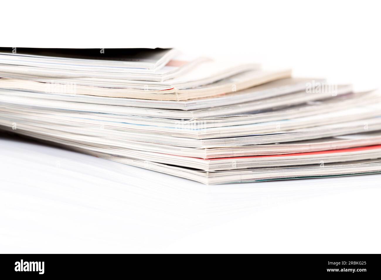 Magazines up close shot on white background Stock Photo - Alamy