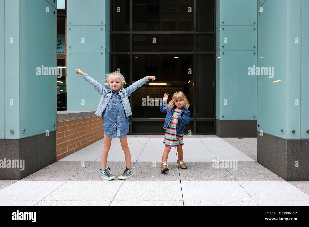 girls playing outside of apartment building Stock Photo - Alamy