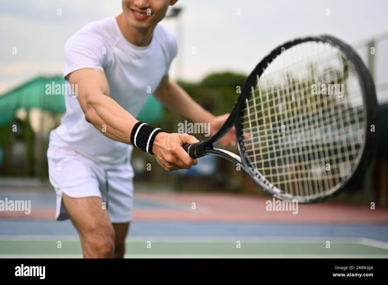 Tennis player hitting ball over net hi-res stock photography and images ...