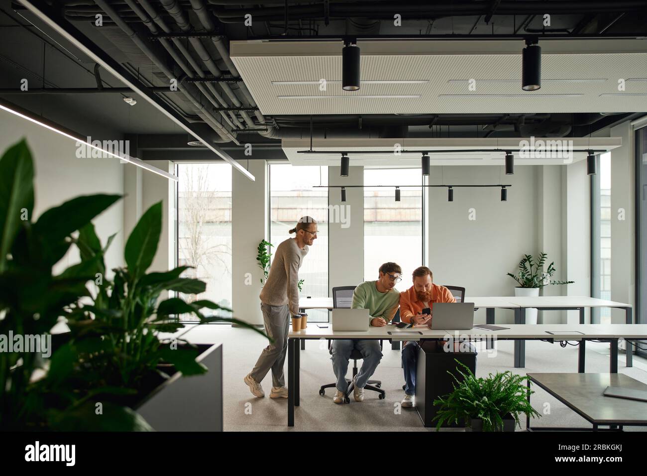 creative and successful team in stylish casual clothes working near ...