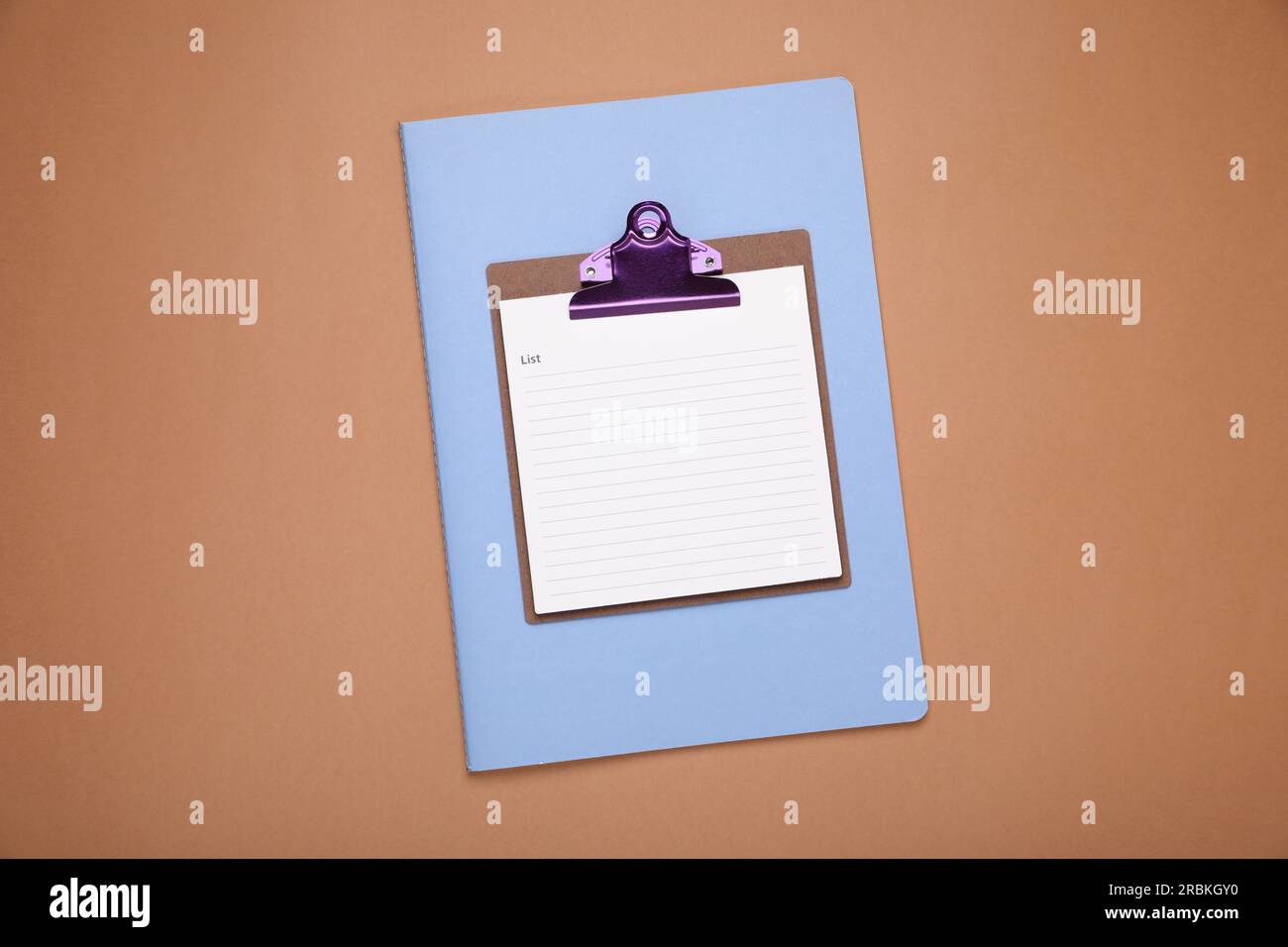 Clipboard with to do notes and planner on brown background, top view ...