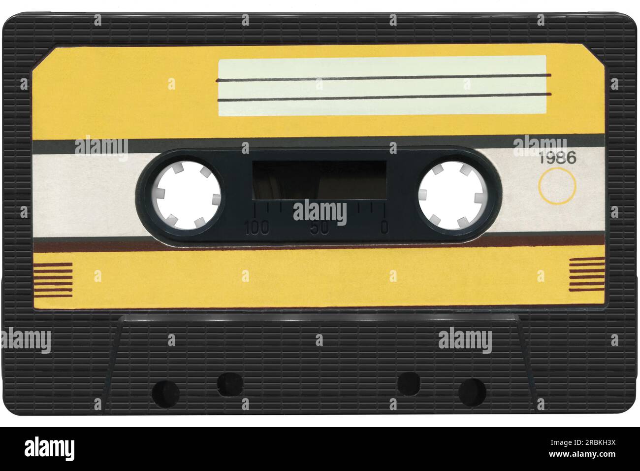Black audio cassette, compact cassette, cassette tape with a yellow label. High resolution ...
