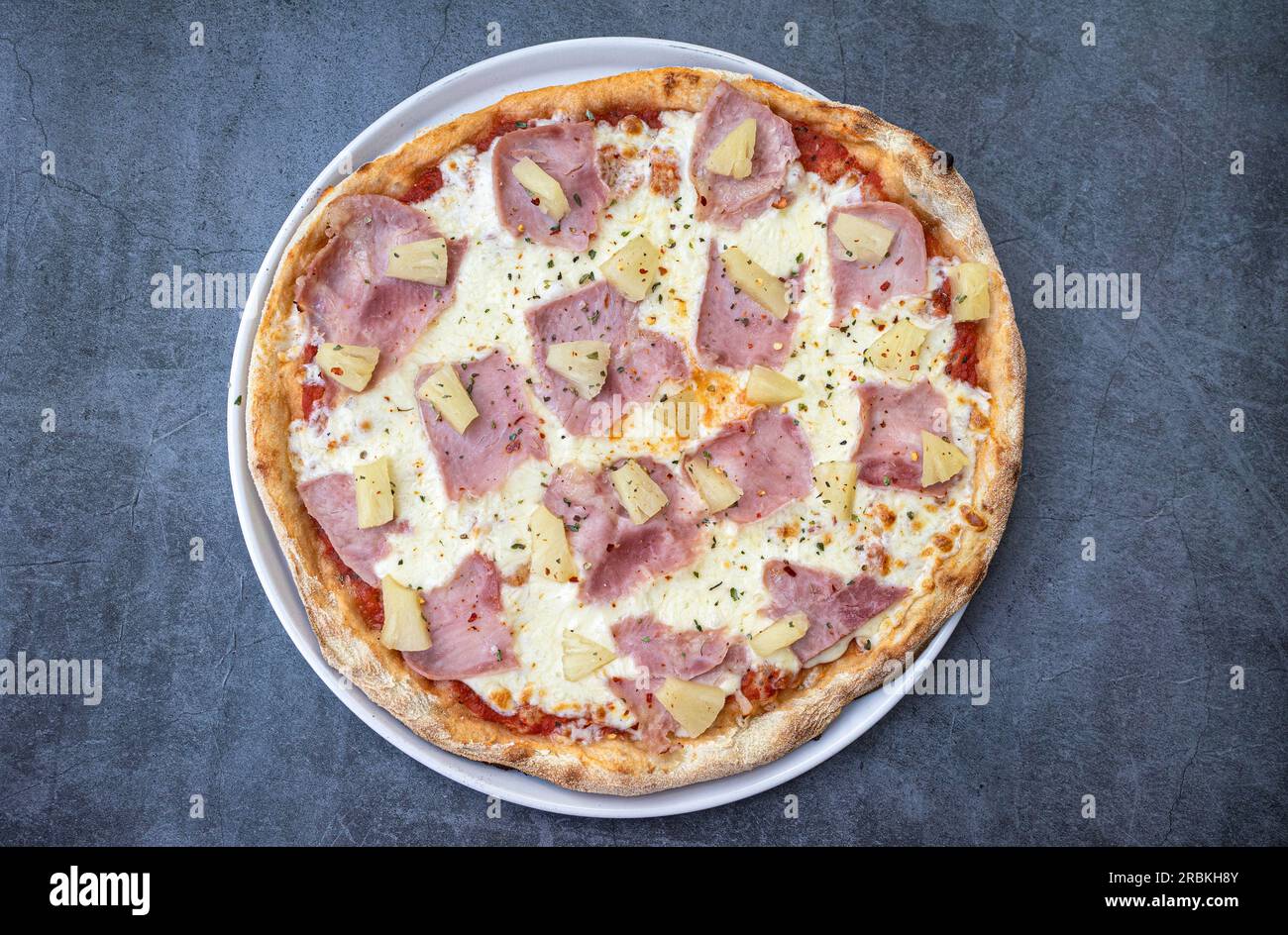 Delicious Hawaiian-style pizza on a rustic background. top view Stock ...