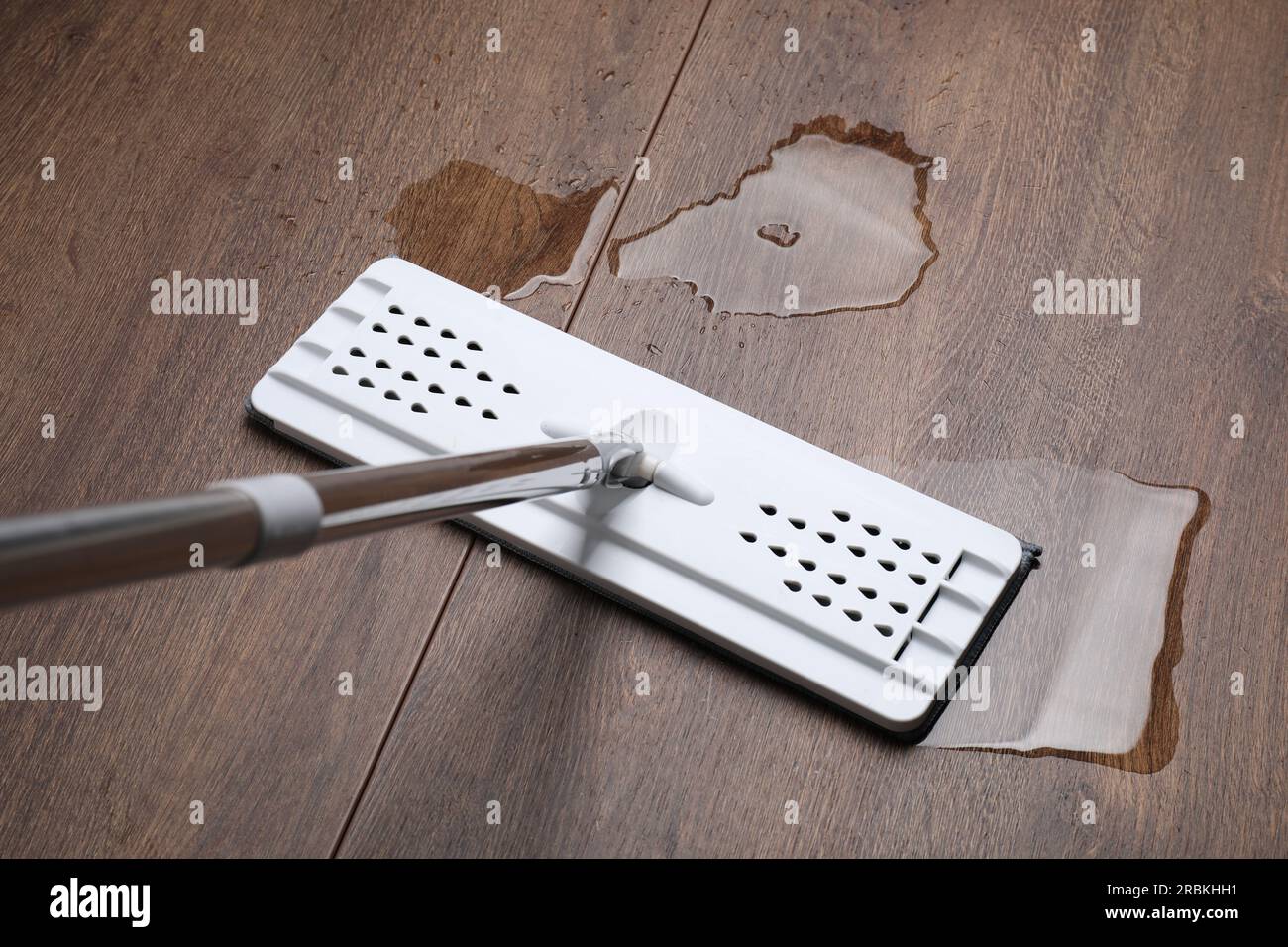 Cleaning dirty parquet floor with mop, above view Stock Photo - Alamy