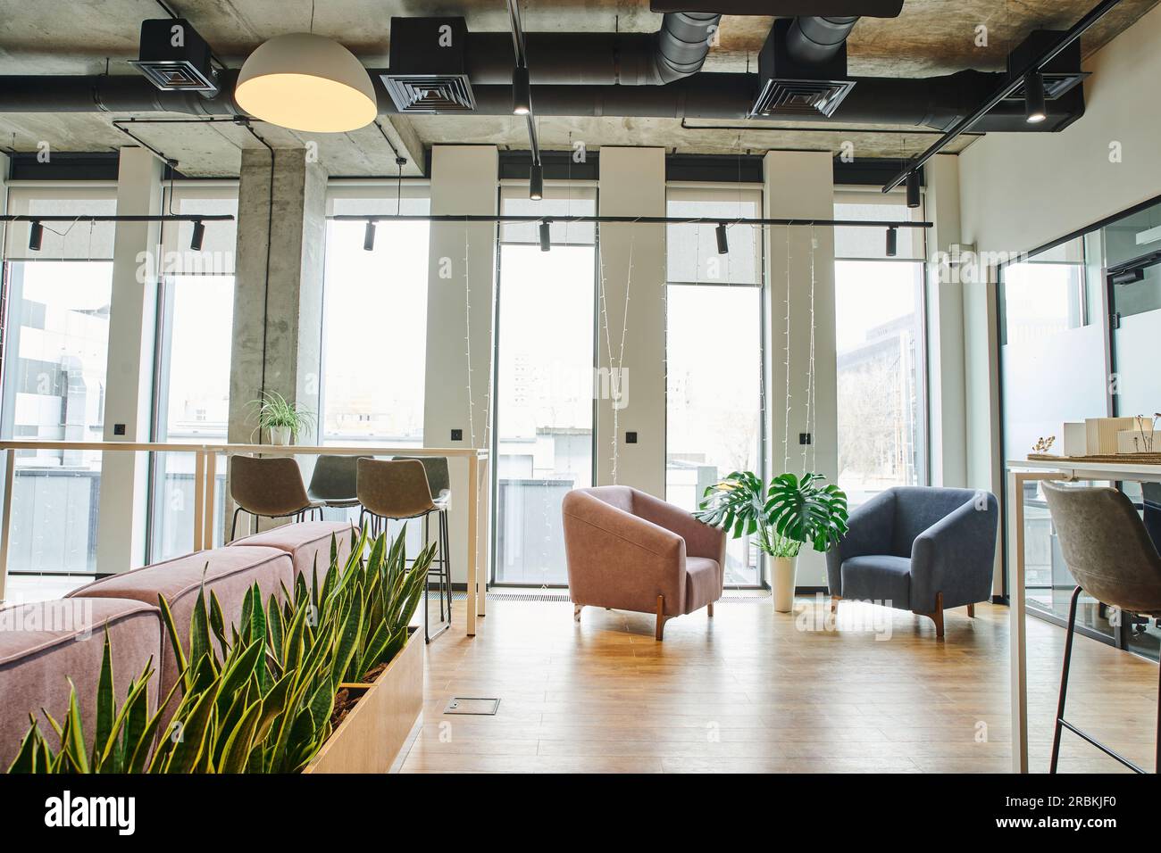 cozy waiting lounge with large windows, soft and comfortable armchairs ...