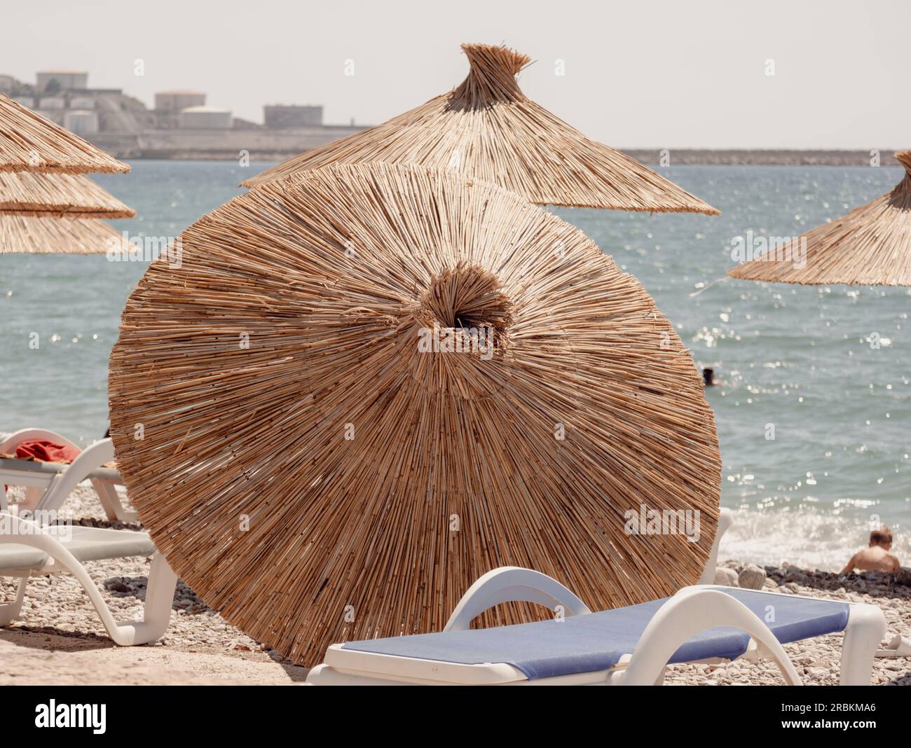 A fallen bamboo umbrella on the beach. Empty holiday spots Stock Photo ...