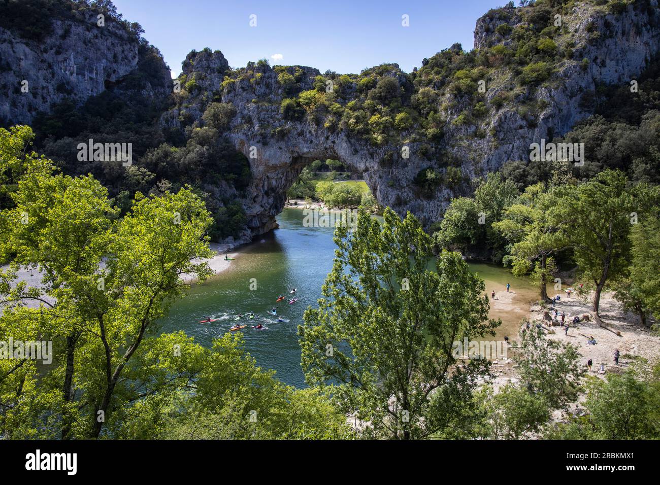 Rock arch Pont Arch in the Gorges de L'ardèche with canoes and sandbar ...