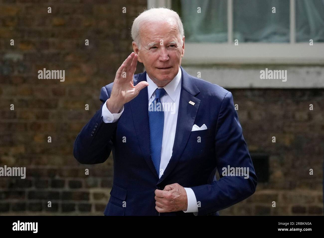 US President Joe Biden waves upon arriving for a meeting with Britain's ...