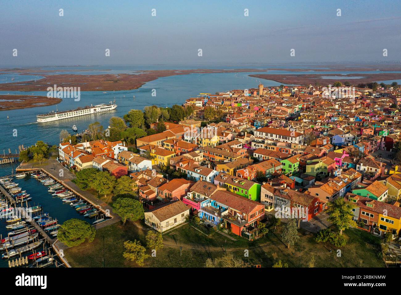 Aerial view of river cruise ship SS La Venezia passing Burano island ...