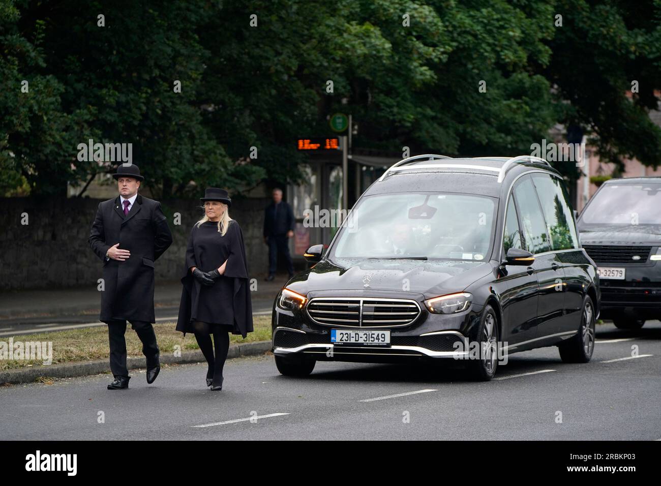 The hearse carrying the coffin of Max Wall arrives at The Church of the ...