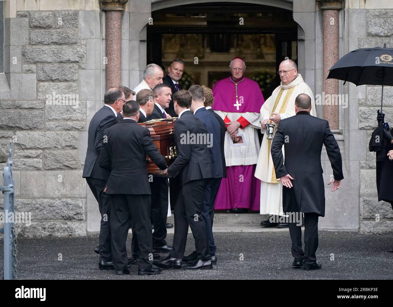 The coffin of Max Wall is carried into The Church of the Sacred Heart ...