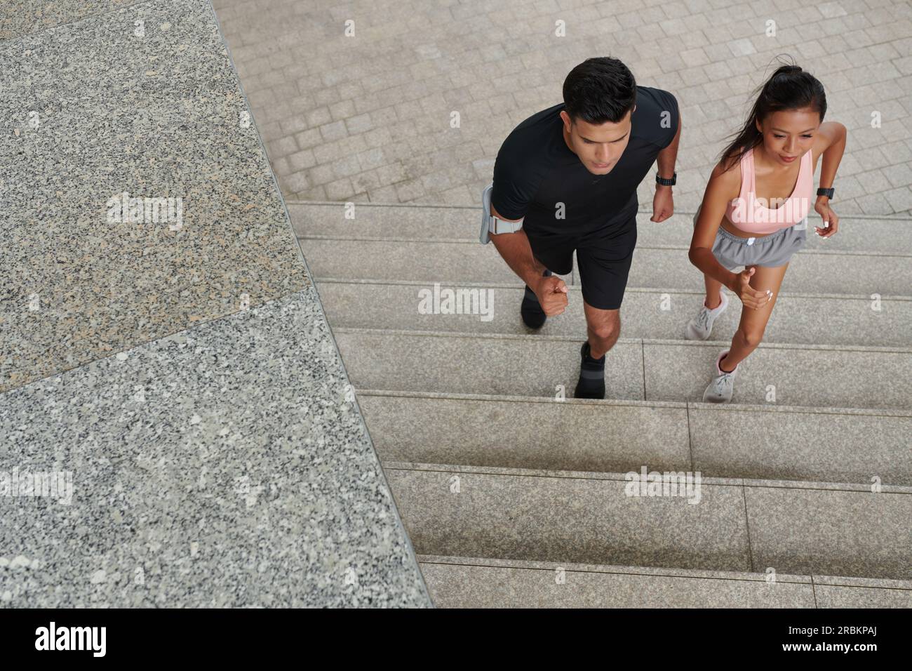 Couple running up stairs hi-res stock photography and images - Alamy