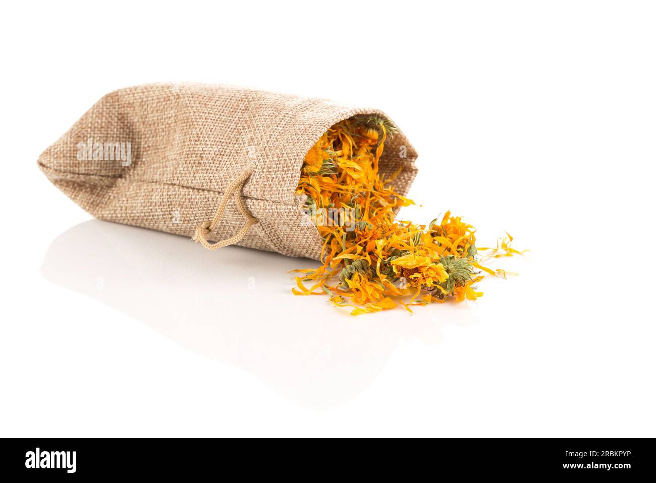 Calendula flowewr tea for infusion in sack on white background Stock ...