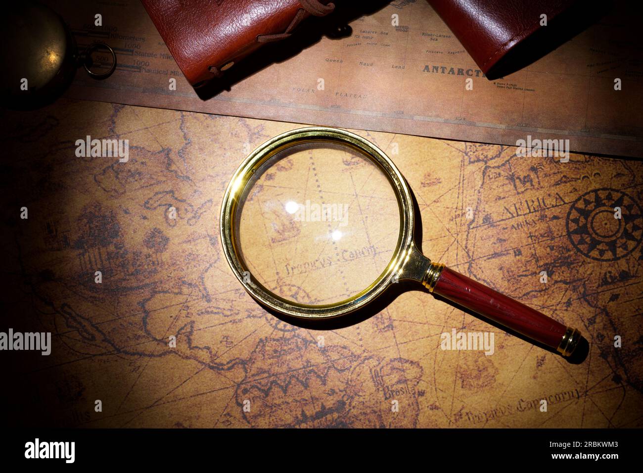 Ancient world map magnifying glass hi-res stock photography and images ...