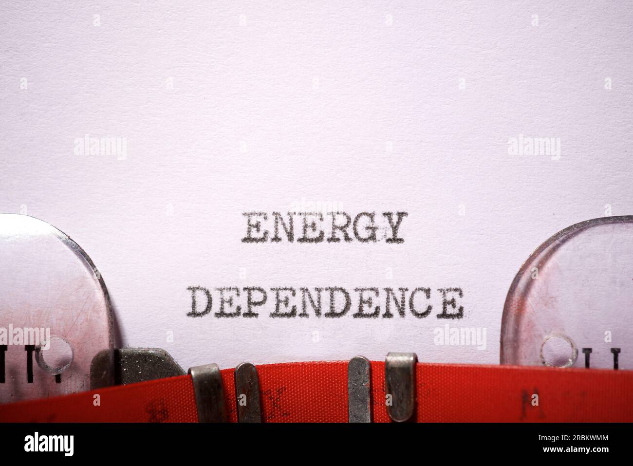 Energy dependence text written with a typewriter Stock Photo - Alamy