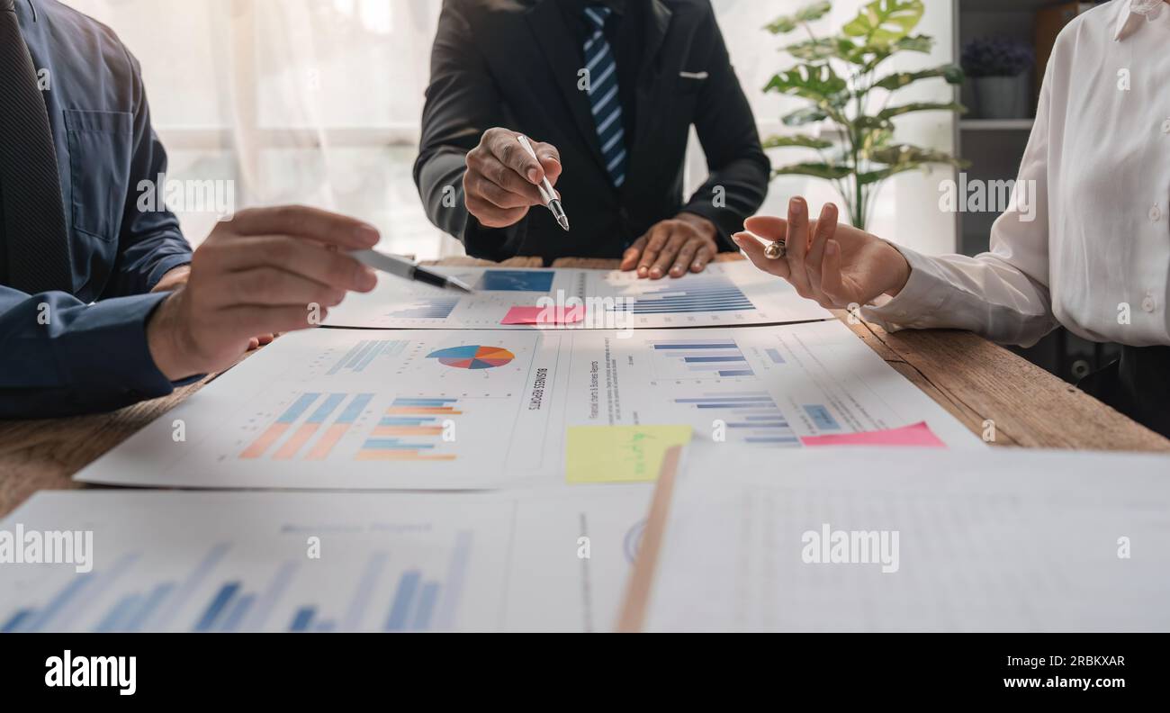 Business team analyzing income charts and graphs in office. Close up ...
