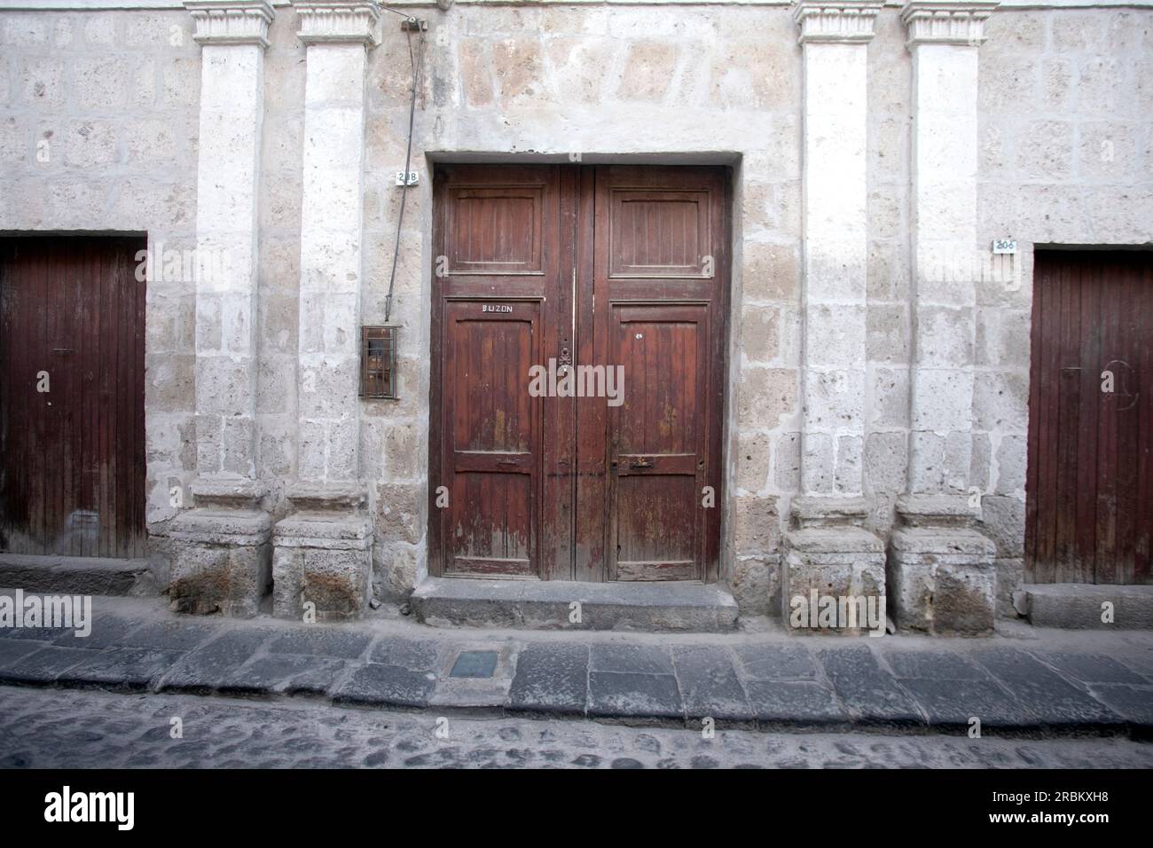 White walls and doors of the old streets of the city of Arequipa in ...