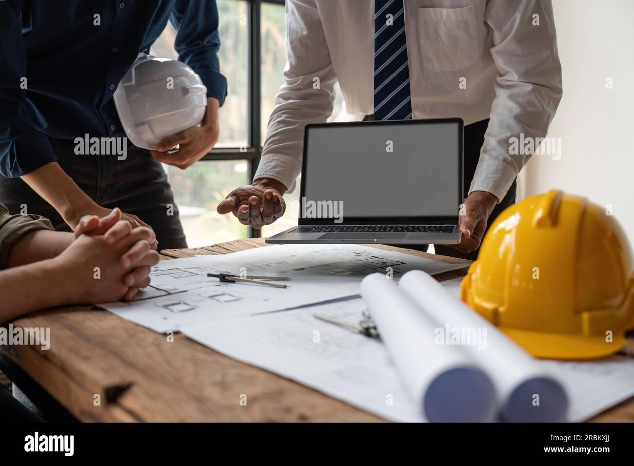 engineer team working in office with blueprints, inspection in ...
