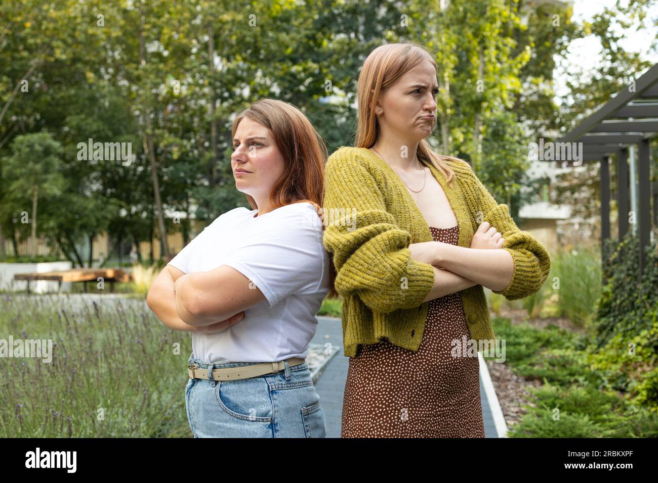 Angry woman having serious conversation with friend outdoors. Quarrel ...