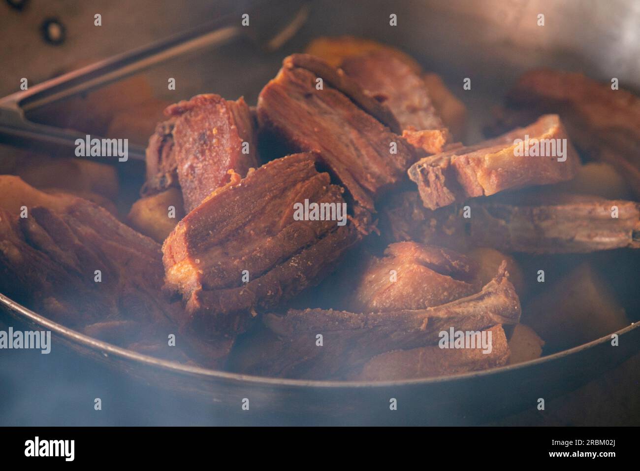 Pork chicharrón is a traditional food in Peru. Pork fat is used to cook ...