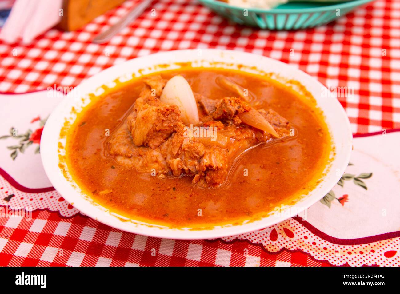 The Adobo de Chancho arequipeño consists of a marinated pork meat dish ...