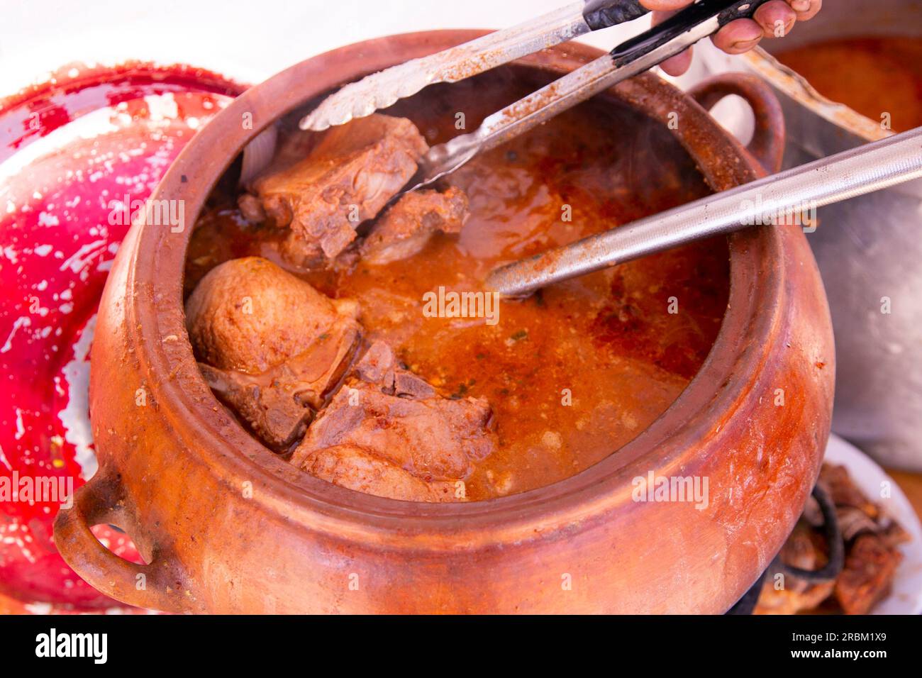 The Adobo de Chancho arequipeño consists of a marinated pork meat dish ...