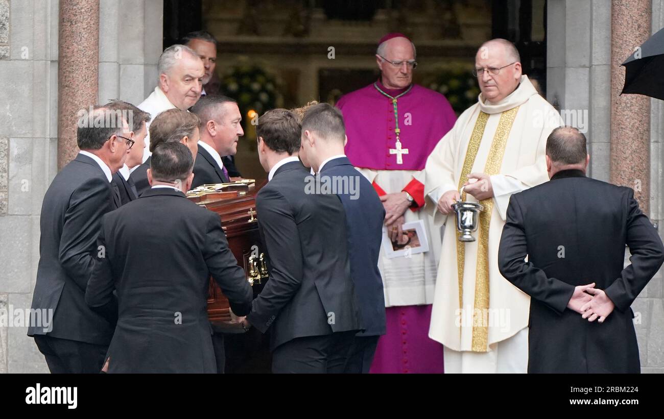 The coffin of Max Wall is carried into The Church of the Sacred Heart ...
