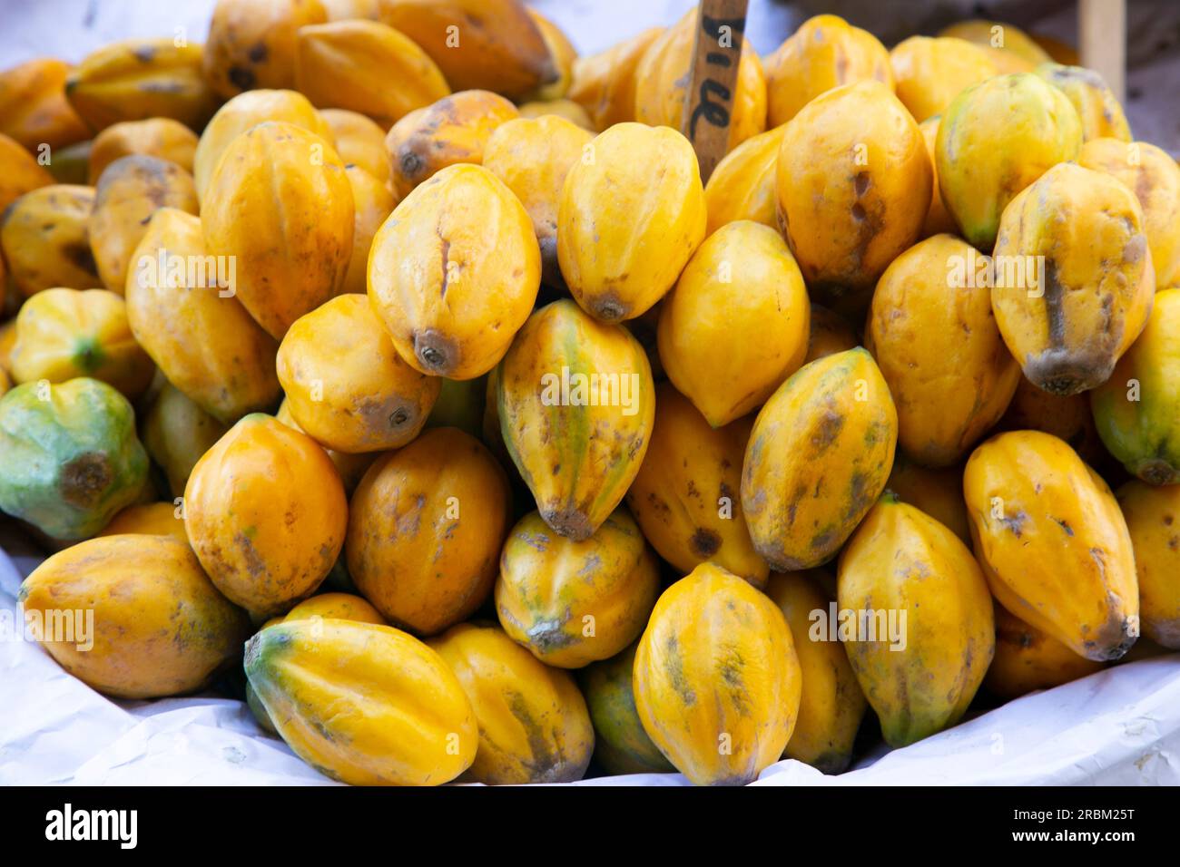 Mangoes and papayas at a stall in the central fruit and vegetable ...