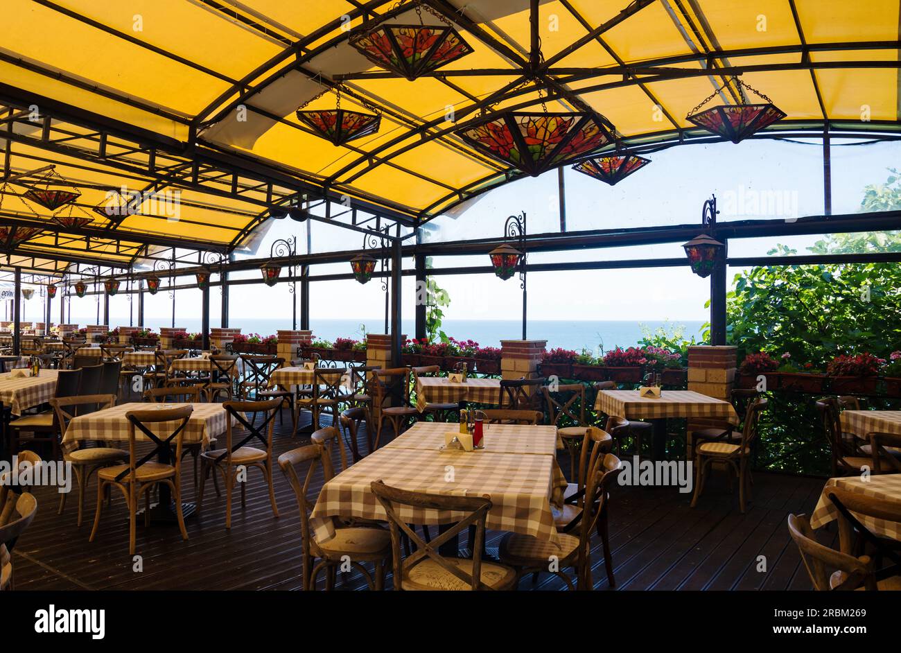Beautiful cafe with flowers in Bulgaria. Outdoor restaurant, summer ...