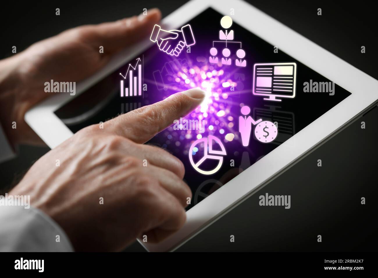 Marketing. Man using tablet against black background, closeup. Virtual ...