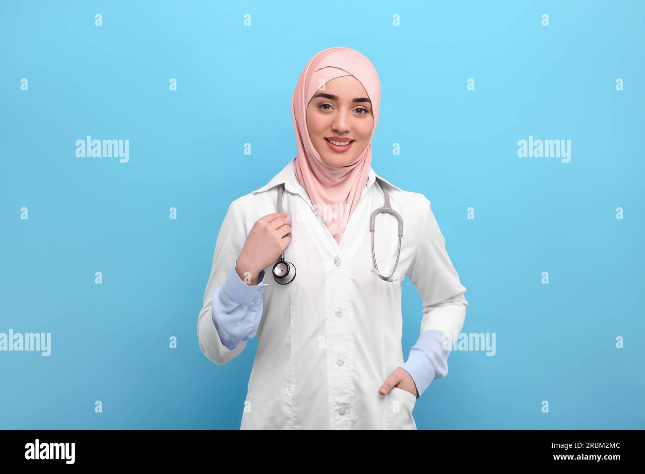 Muslim woman wearing hijab and medical uniform with stethoscope on ...