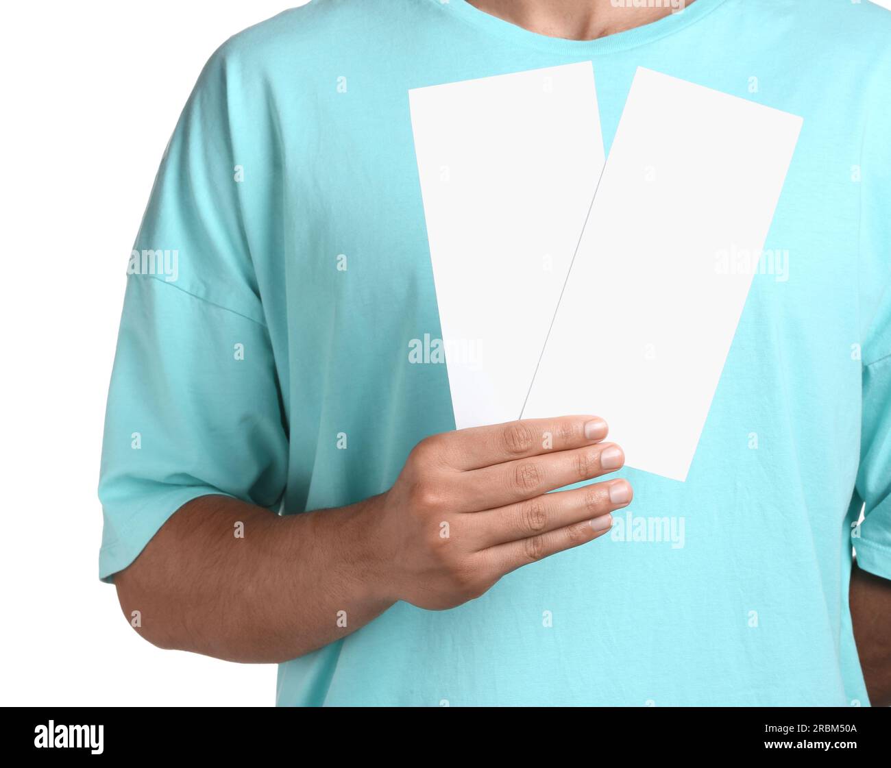 Man holding flyers on white background, closeup. Mockup for design ...