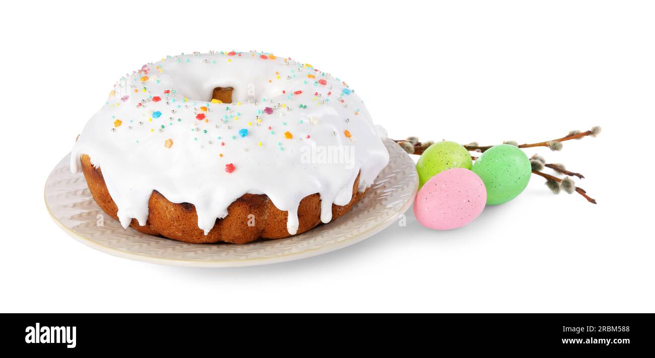 Easter cake with sprinkles, painted eggs and willow branches isolated ...
