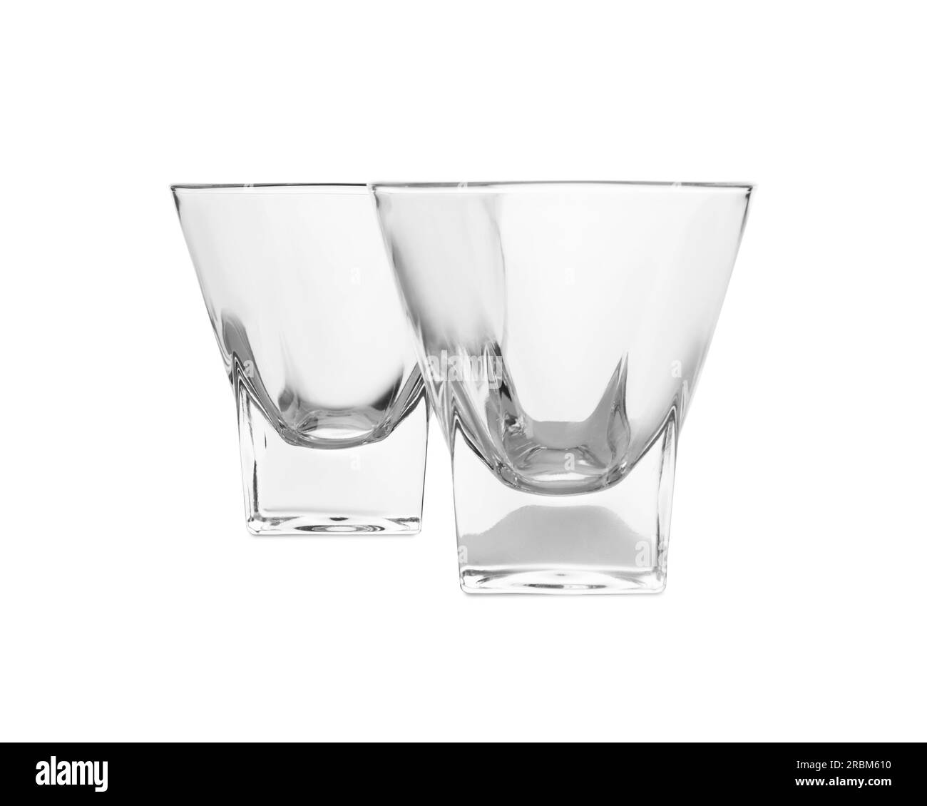 Elegant clean empty shot glasses isolated on white Stock Photo - Alamy