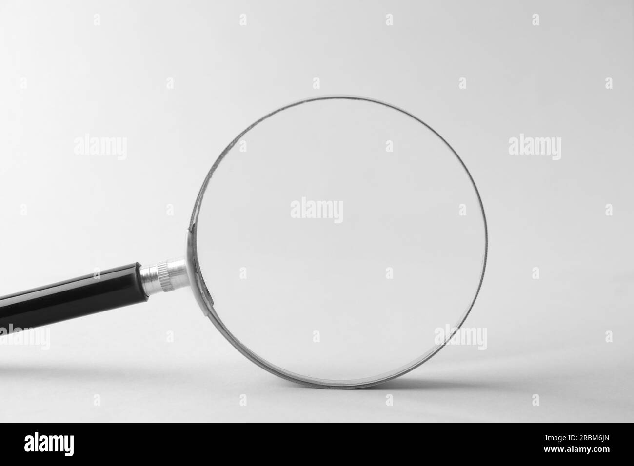 Magnifying glass with handle on white background Stock Photo - Alamy
