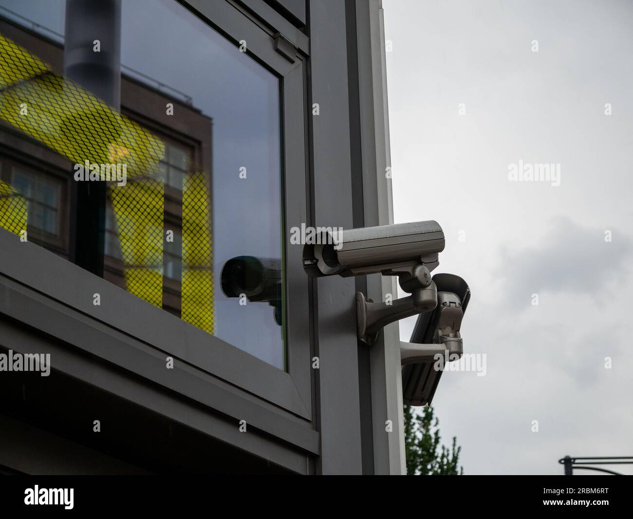 Surveillance camera on the facade of the building. Video surveillance ...