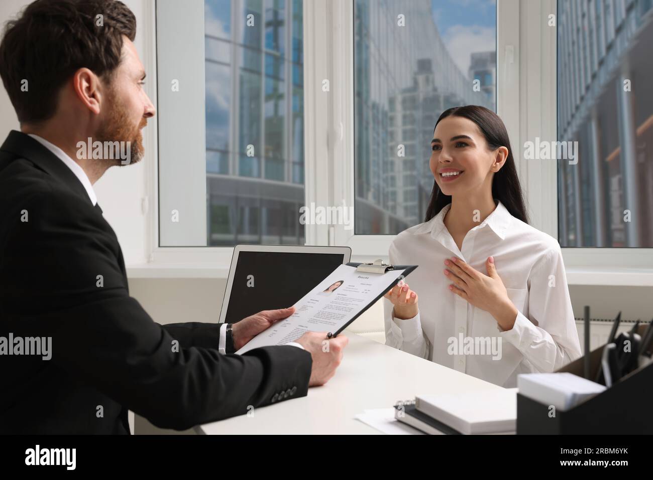 Human resources manager conducting job interview with applicant in office Stock Photo - Alamy