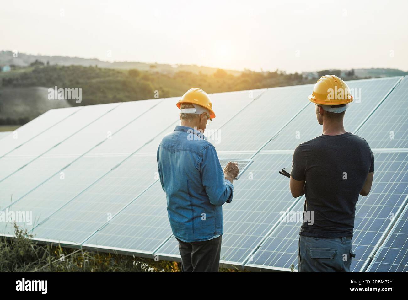 Engineers working at solar panels factory outdoor - Photovoltaic ...