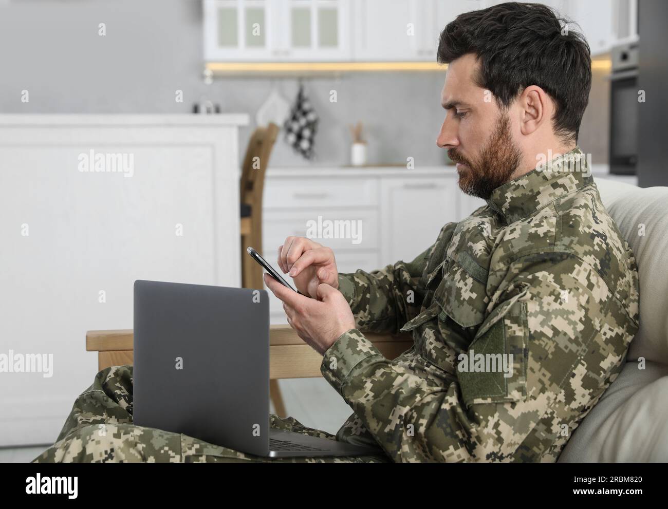 Camouflage soldier laptop hi-res stock photography and images - Alamy